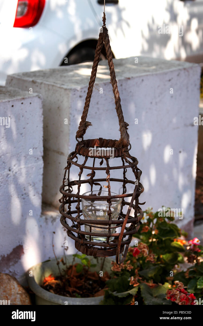 Lampion baskets with glass and candle Stock Photo - Alamy