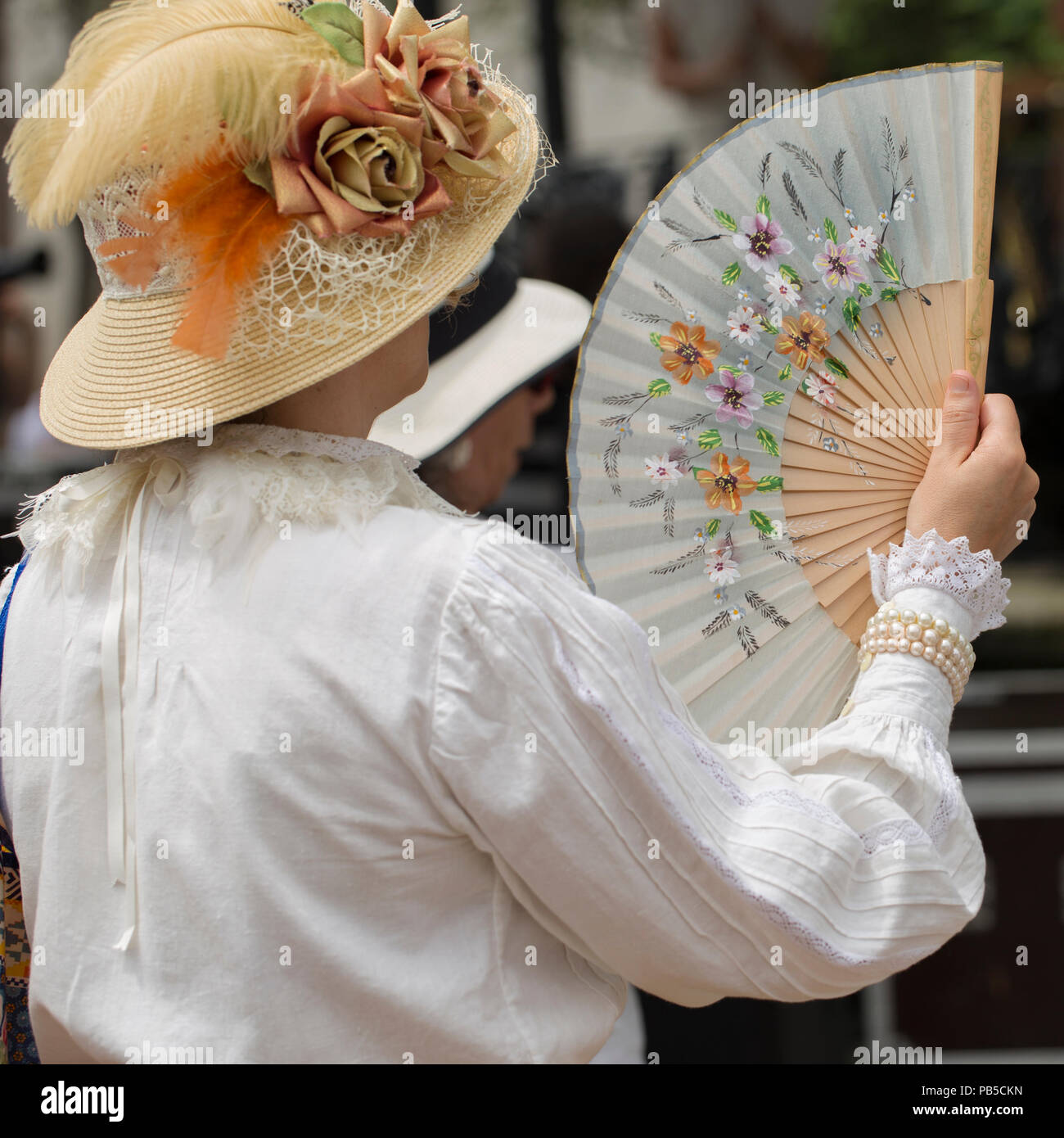 Woman using fan hi-res stock photography and images - Alamy