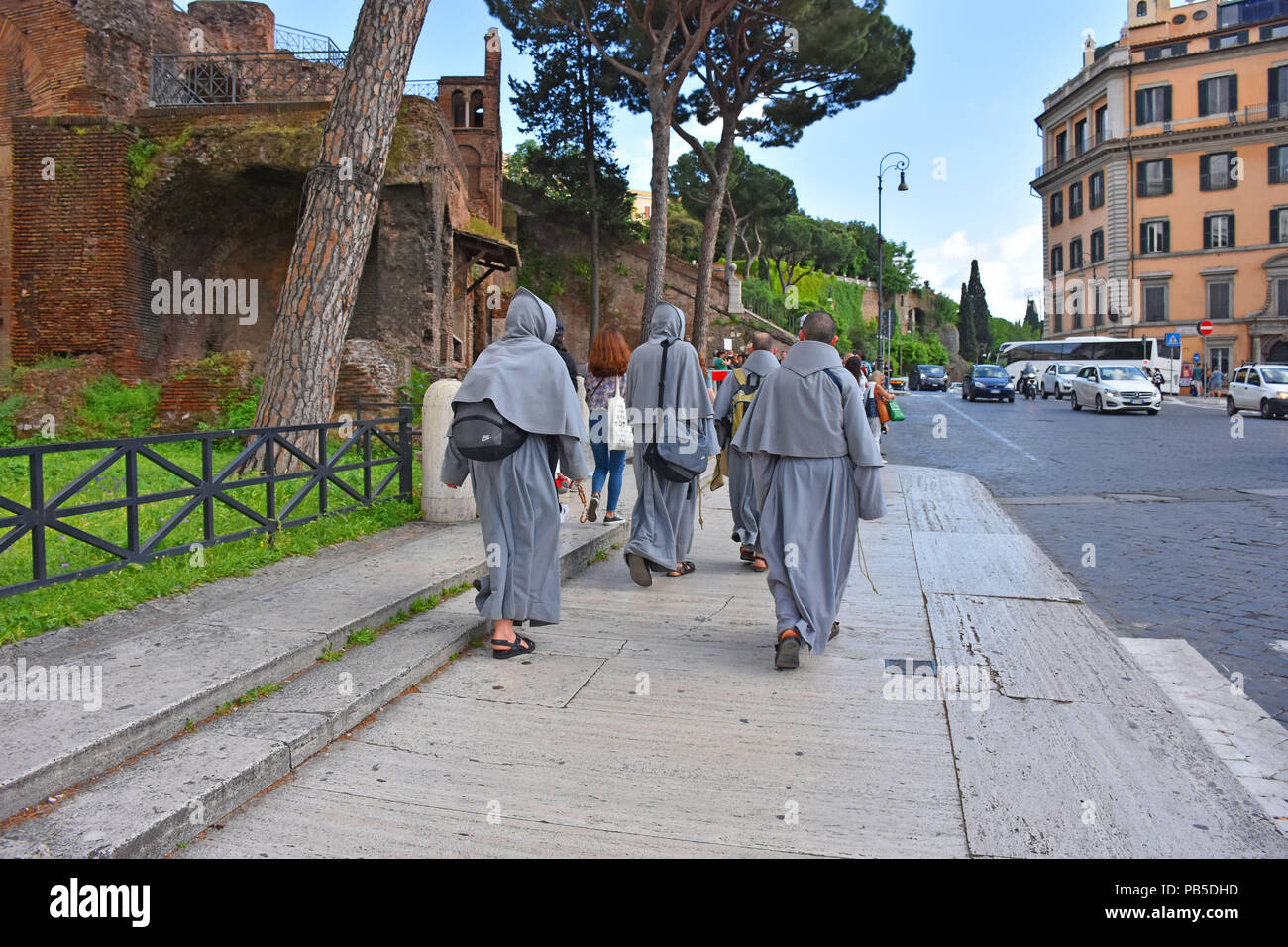 Rome, monks walk along a city street Stock Photo - Alamy