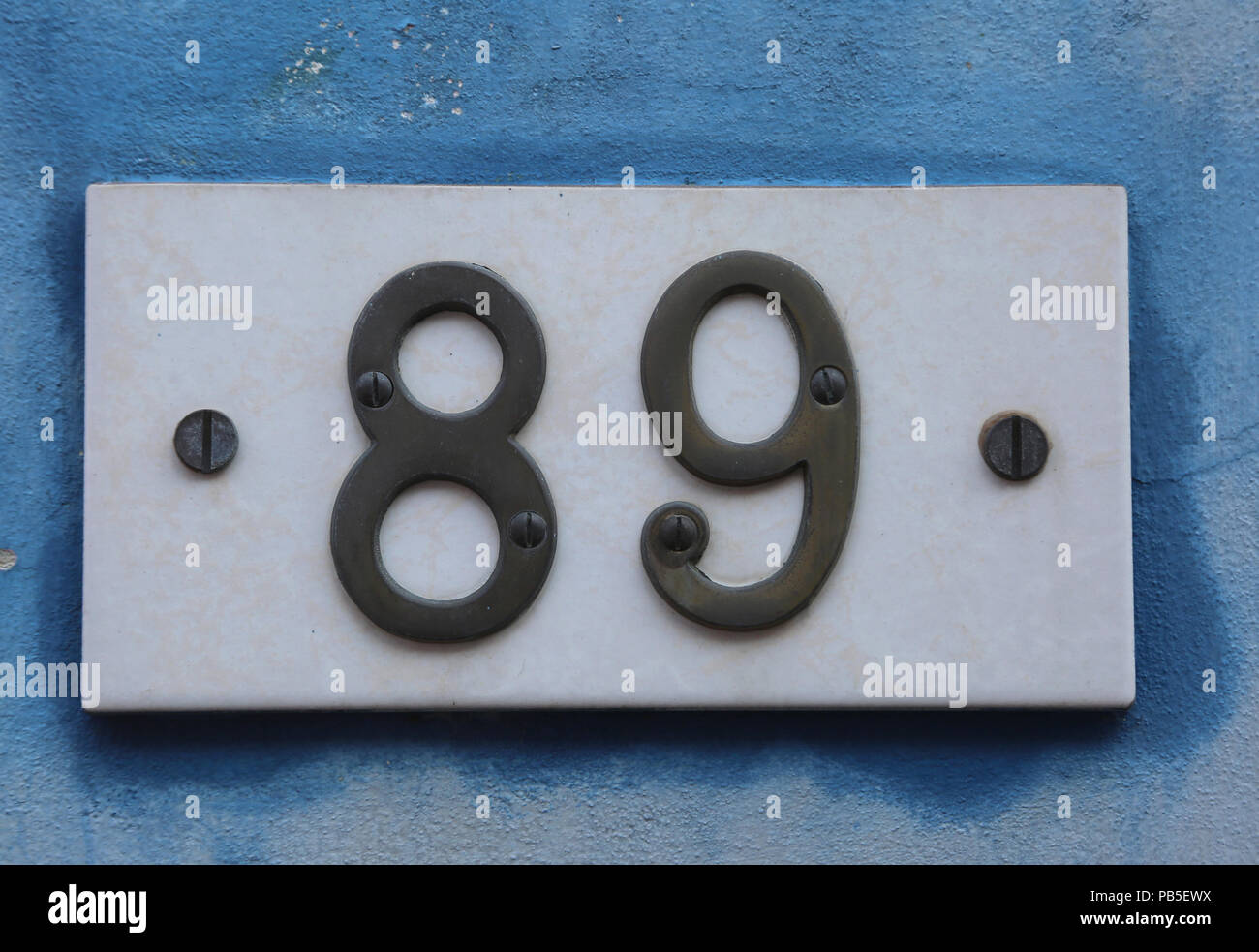 Big Text with number 89 on the wall of an house Stock Photo - Alamy