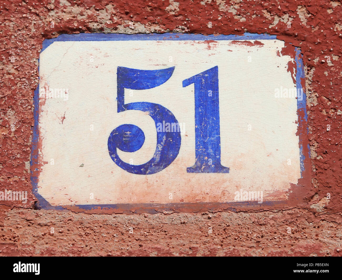 Blue Text with number 51 on the wall Stock Photo - Alamy