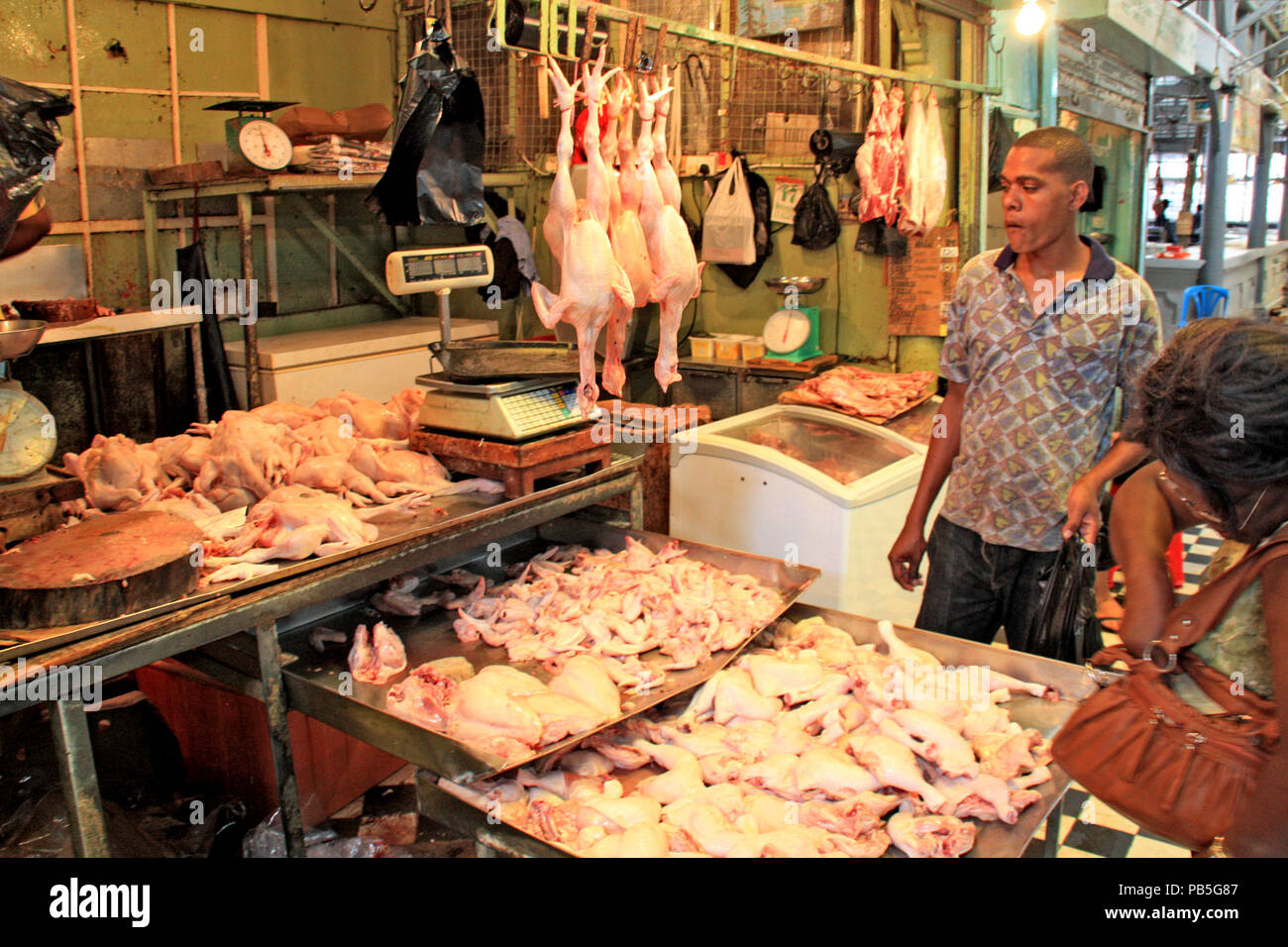 Dead chicken and chicken parts for sale at a stall in the poultry ...