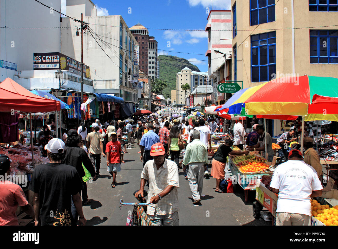 People at the bustling street market outside the official market halls ...