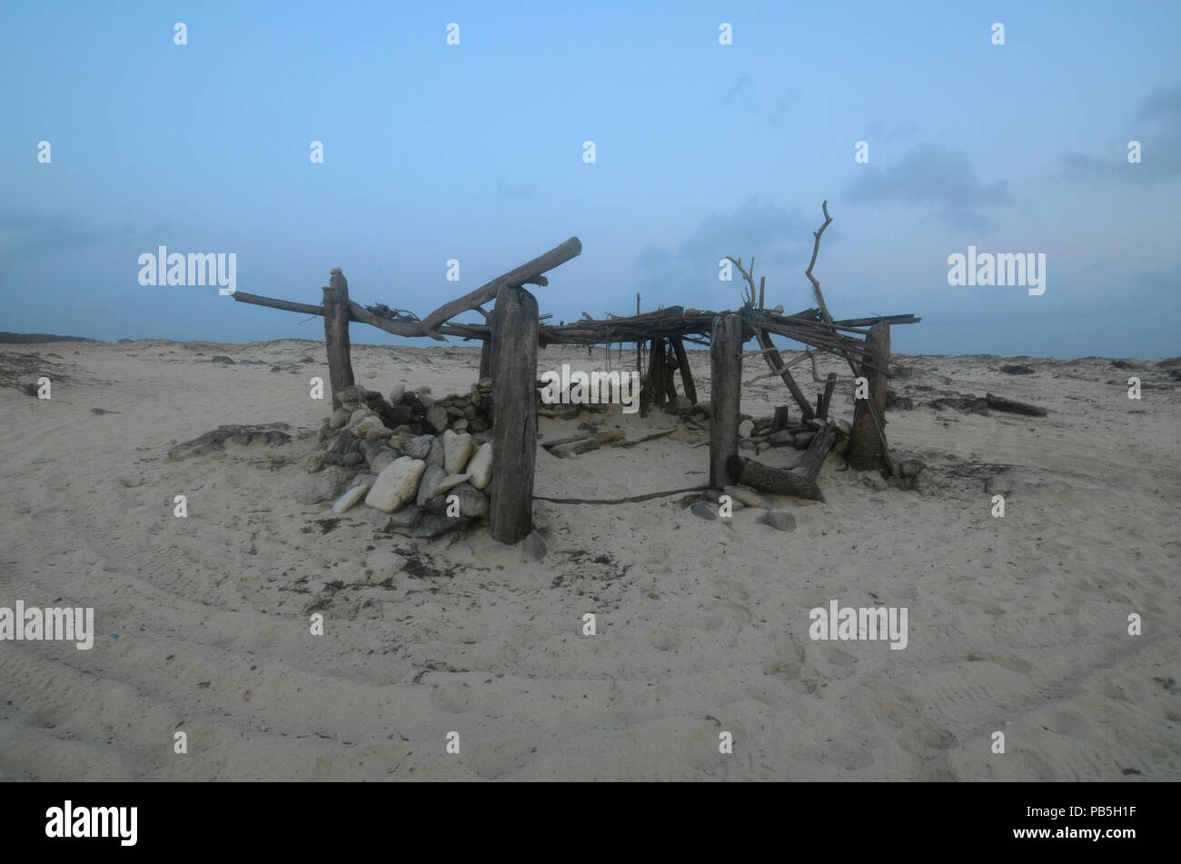 Wooden shade structure on a beach in Aruba Stock Photo - Alamy