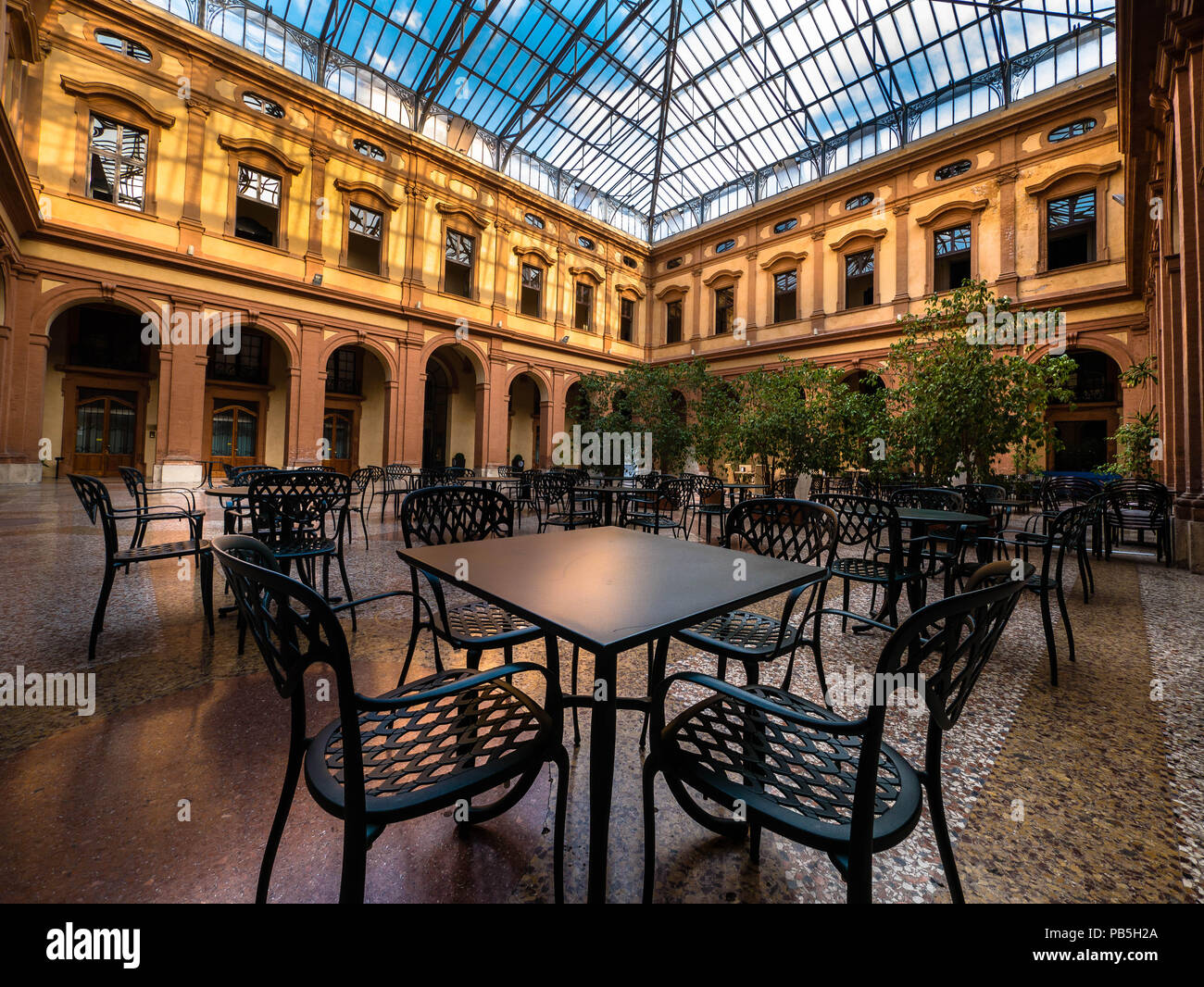 Restaurant table in an awesome inner court of the ancient bourse in ...