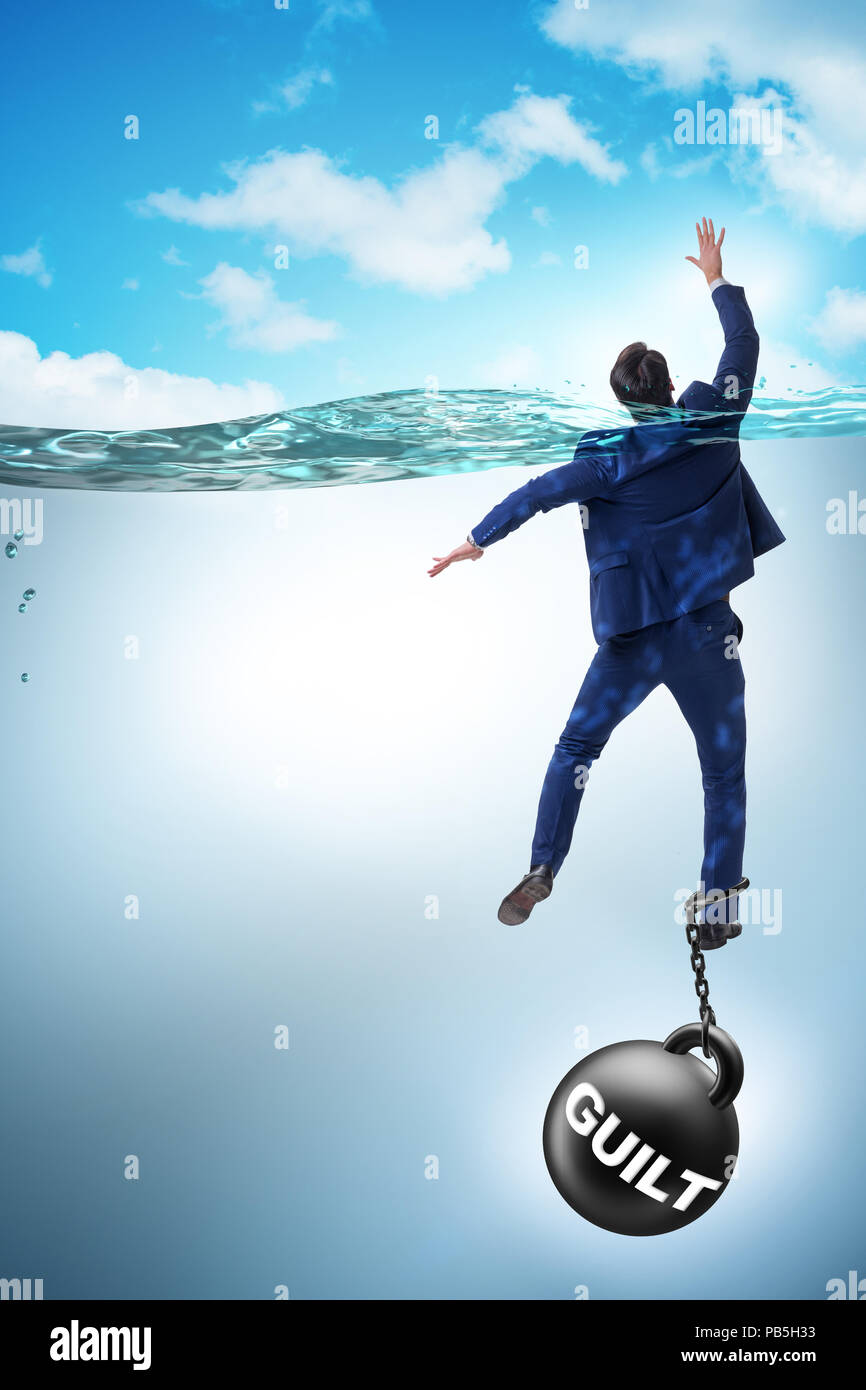 Businessman drowning under the burden of sin and guilt Stock Photo - Alamy