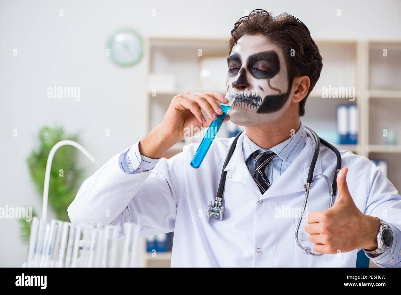 Scary monster doctor working in lab Stock Photo - Alamy