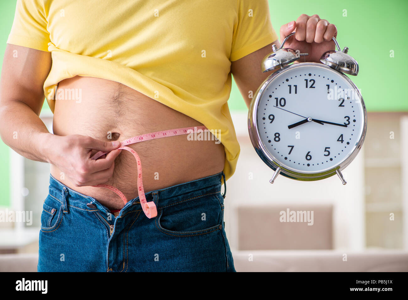 Fat belly checking man not woman hi-res stock photography and images ...