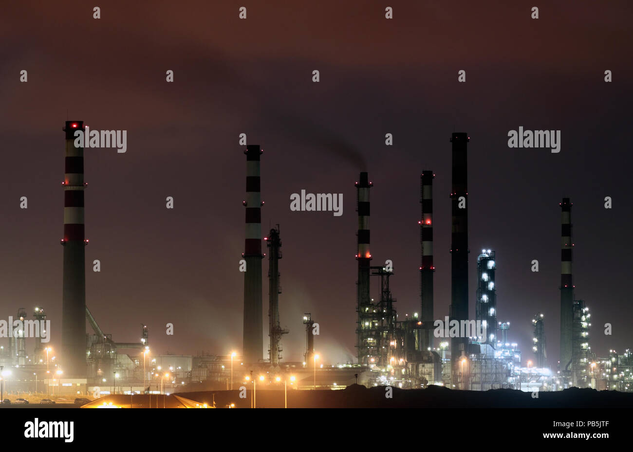 Panorama of part of a big refinery by night Stock Photo - Alamy