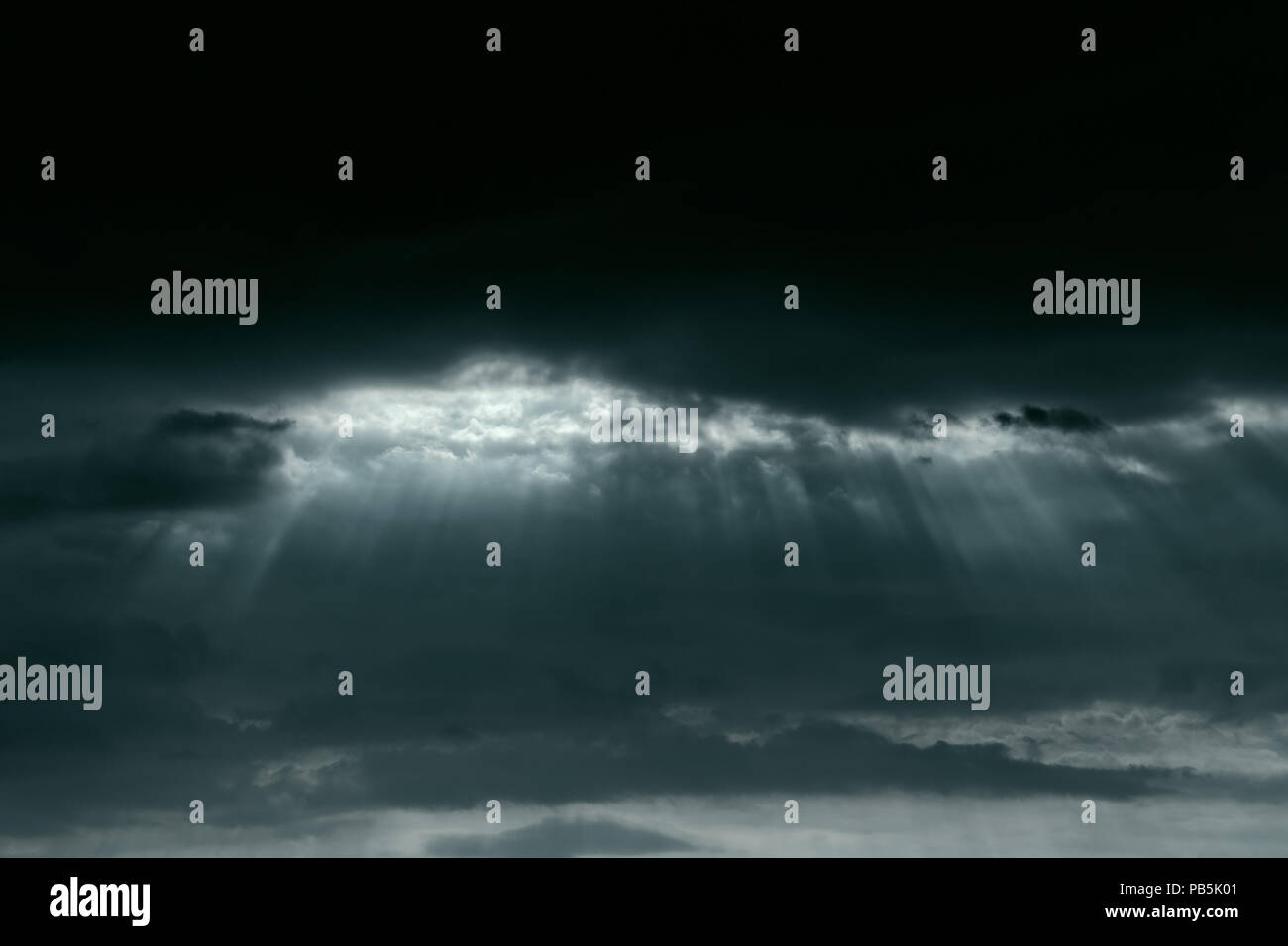 Early spring cloudy sky with natural sunbeams Stock Photo - Alamy