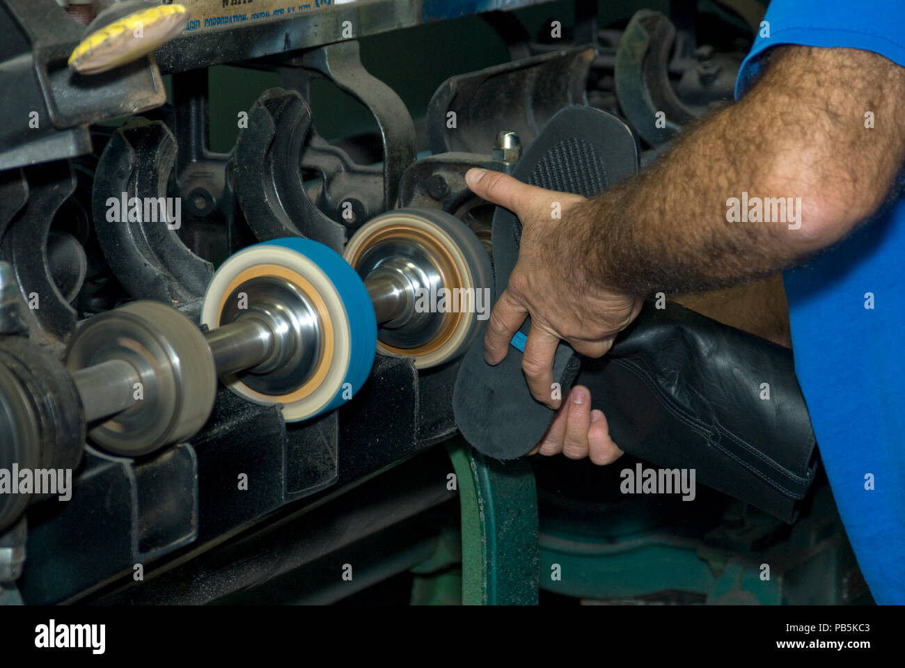 St. Paul, Minnesota. Local shoemaker who immigrated from Iran working a ...