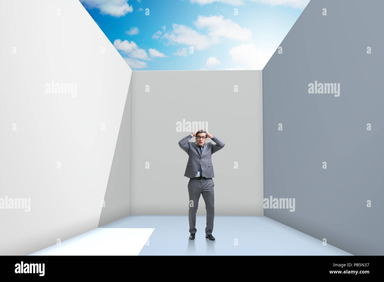 Businessman trying to escape from difficult situation Stock Photo - Alamy