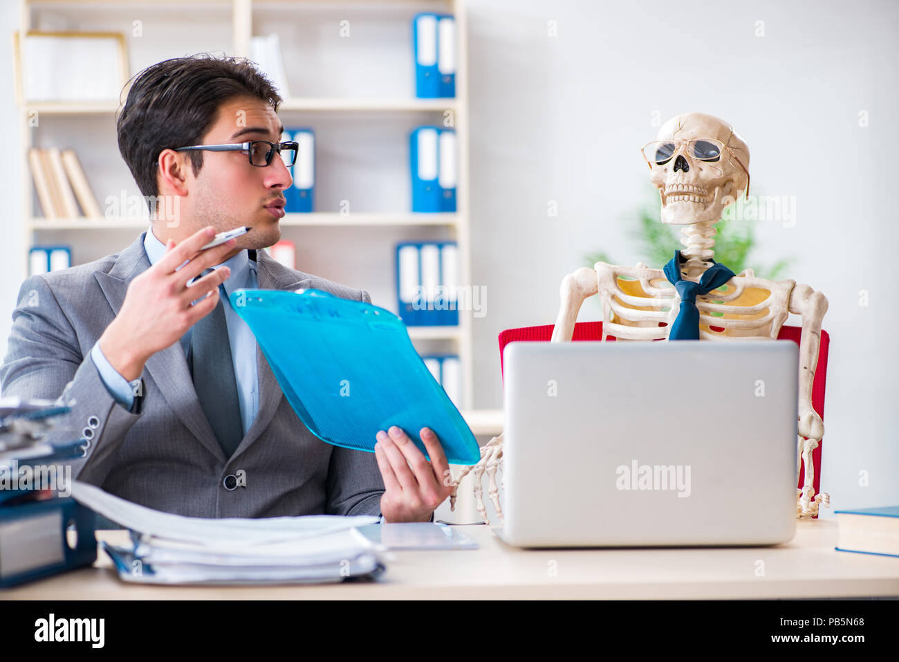 Businessman skeleton in office hi-res stock photography and images - Alamy