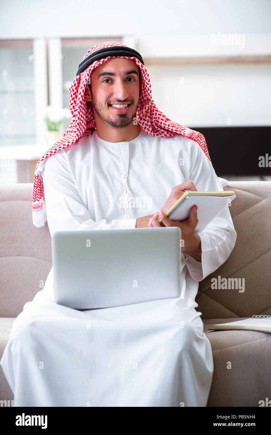 Arab man working at home on his work Stock Photo - Alamy