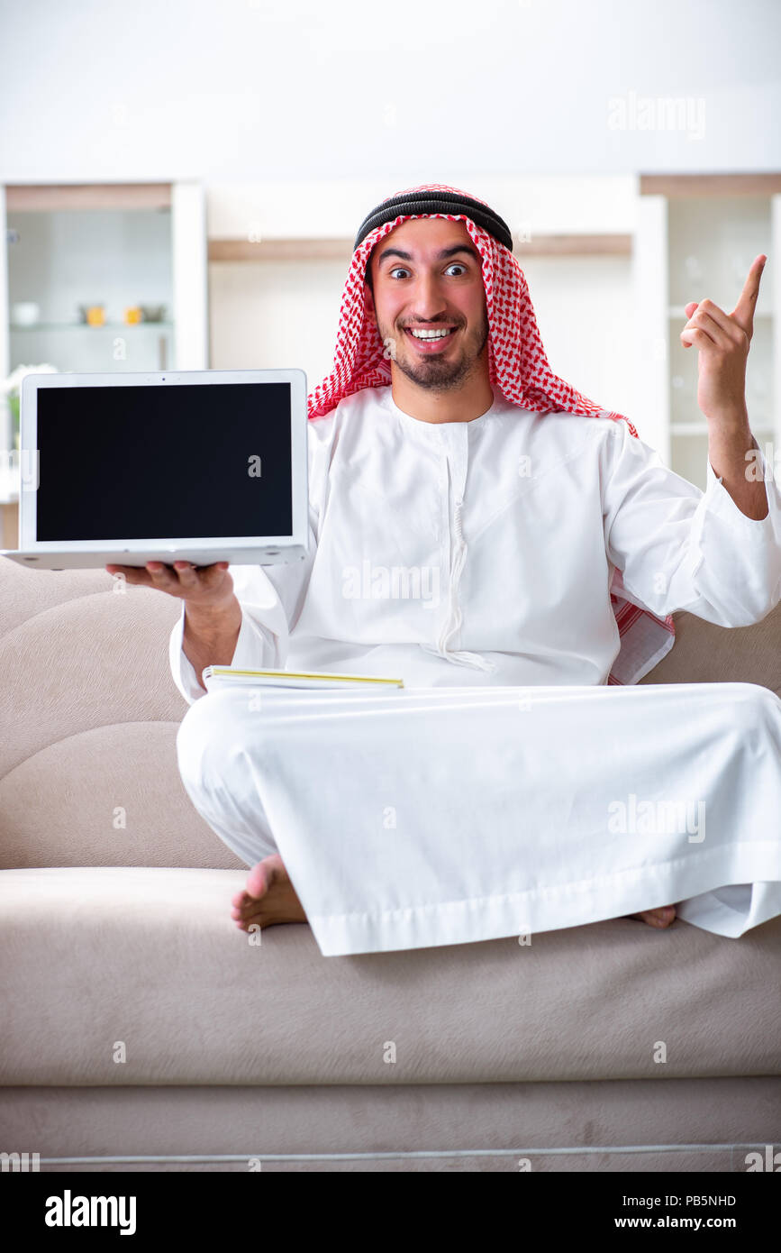 Arab man working at home on his work Stock Photo - Alamy