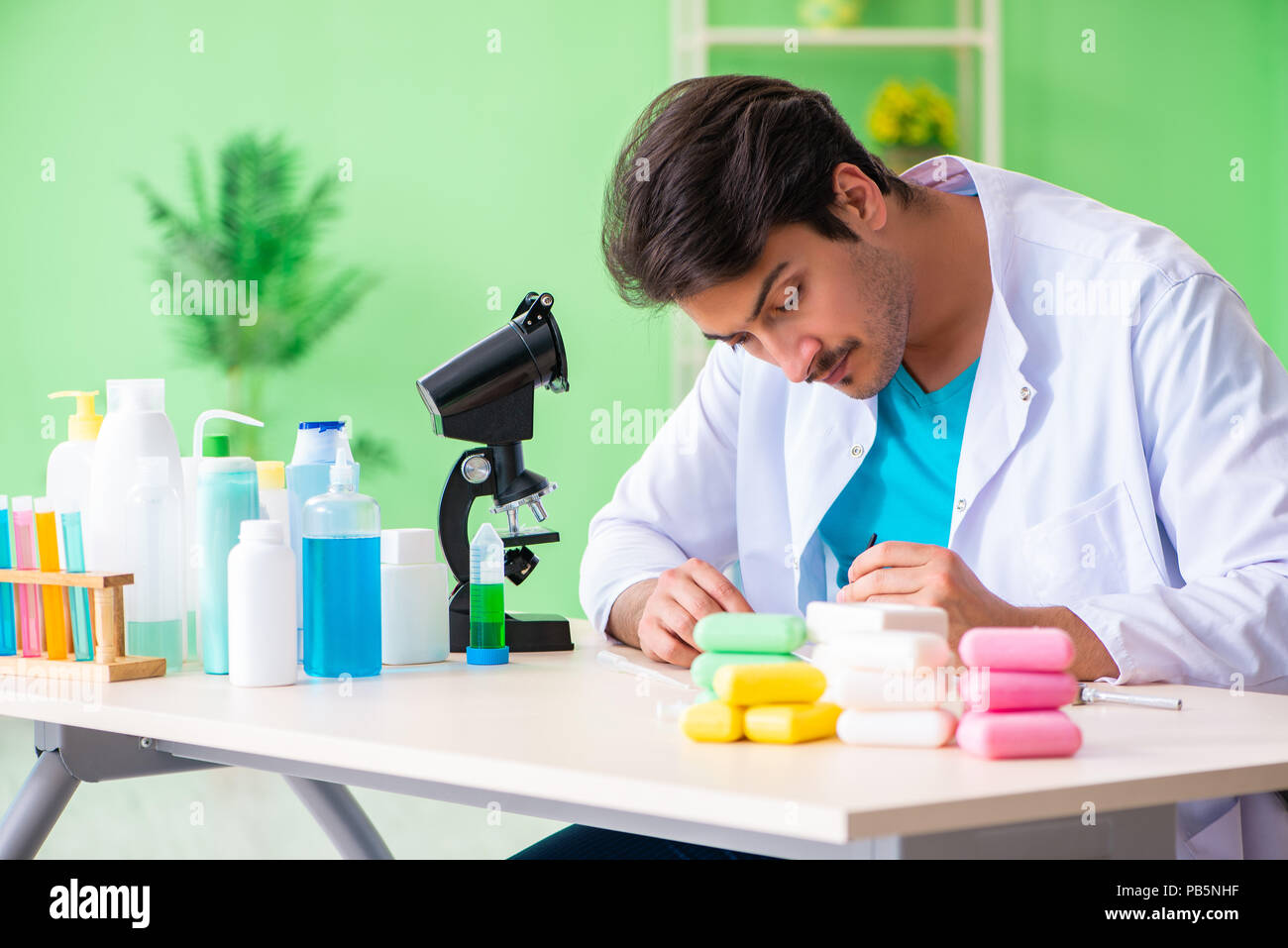 Chemist testing soap in the lab Stock Photo - Alamy