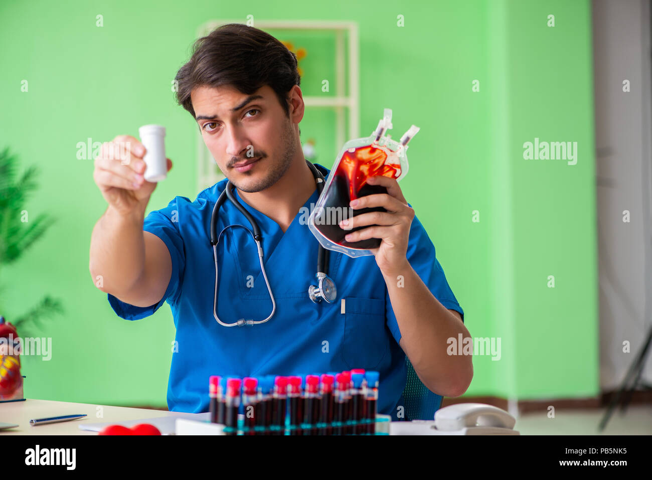 Doctor doing blood analysis in the lab Stock Photo - Alamy