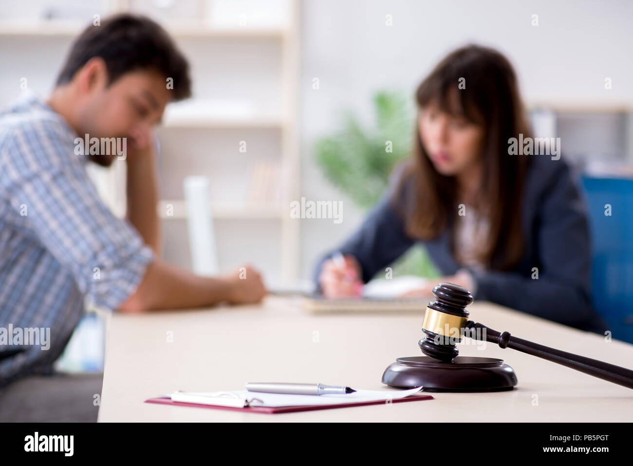 Female lawyer meeting with his male client in the office Stock Photo ...