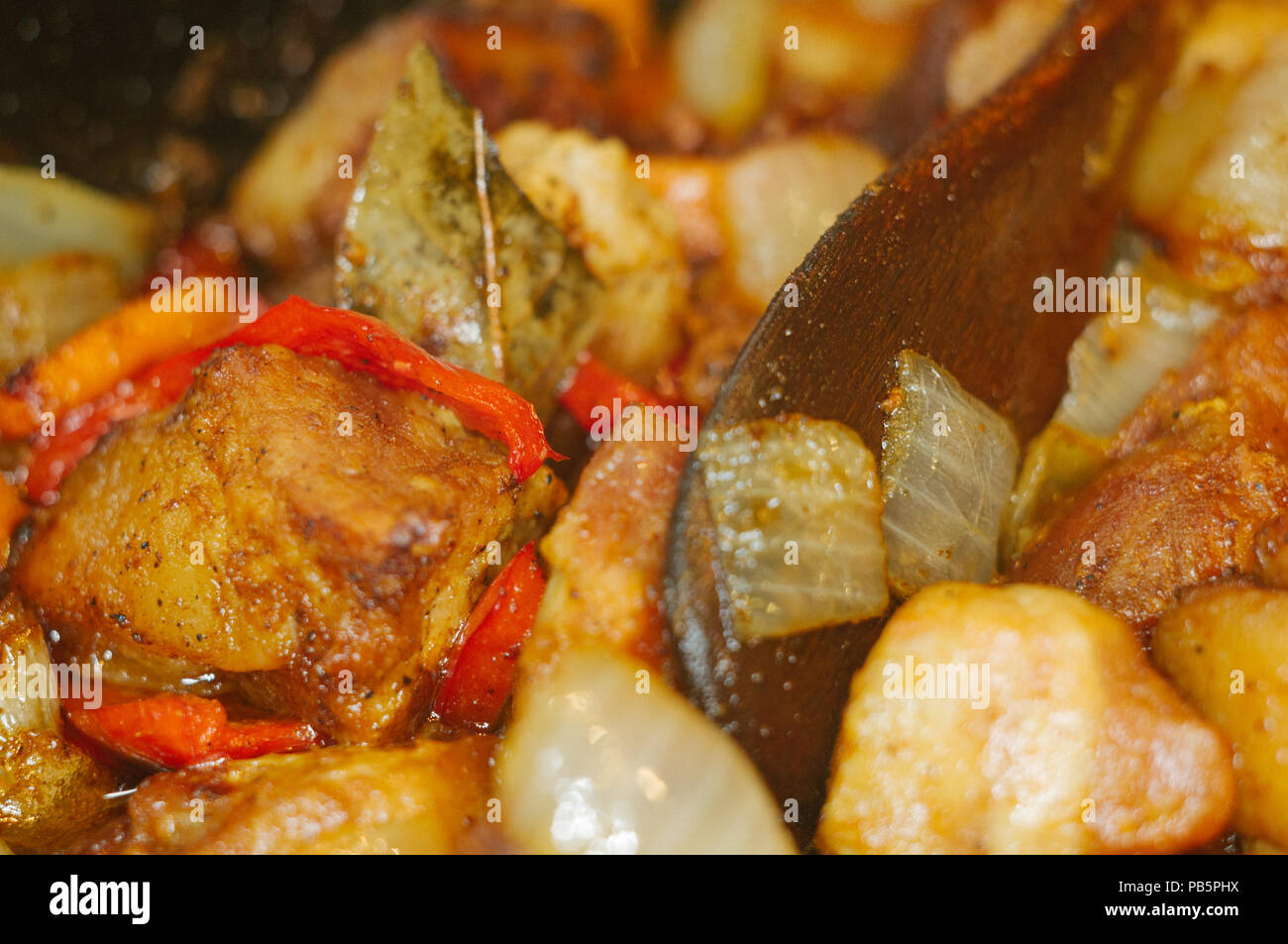 Roast meat, onions, carrots and spices, boiling in oil, homemade ...