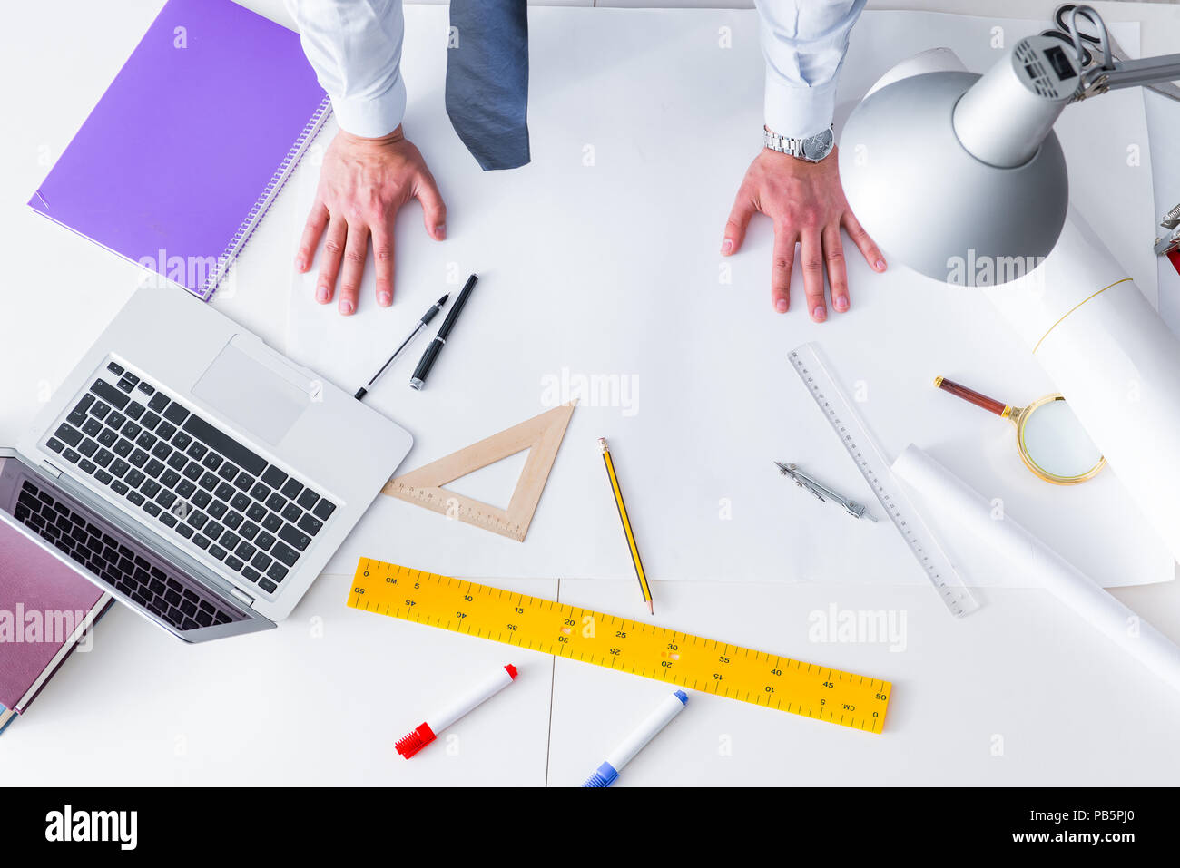 Engineer working on new project drawings Stock Photo - Alamy
