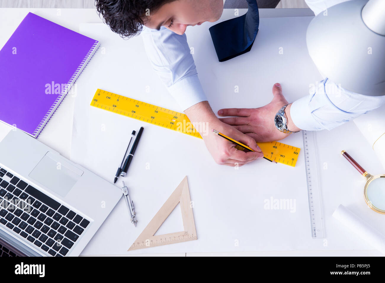 Engineer working on new project drawings Stock Photo - Alamy