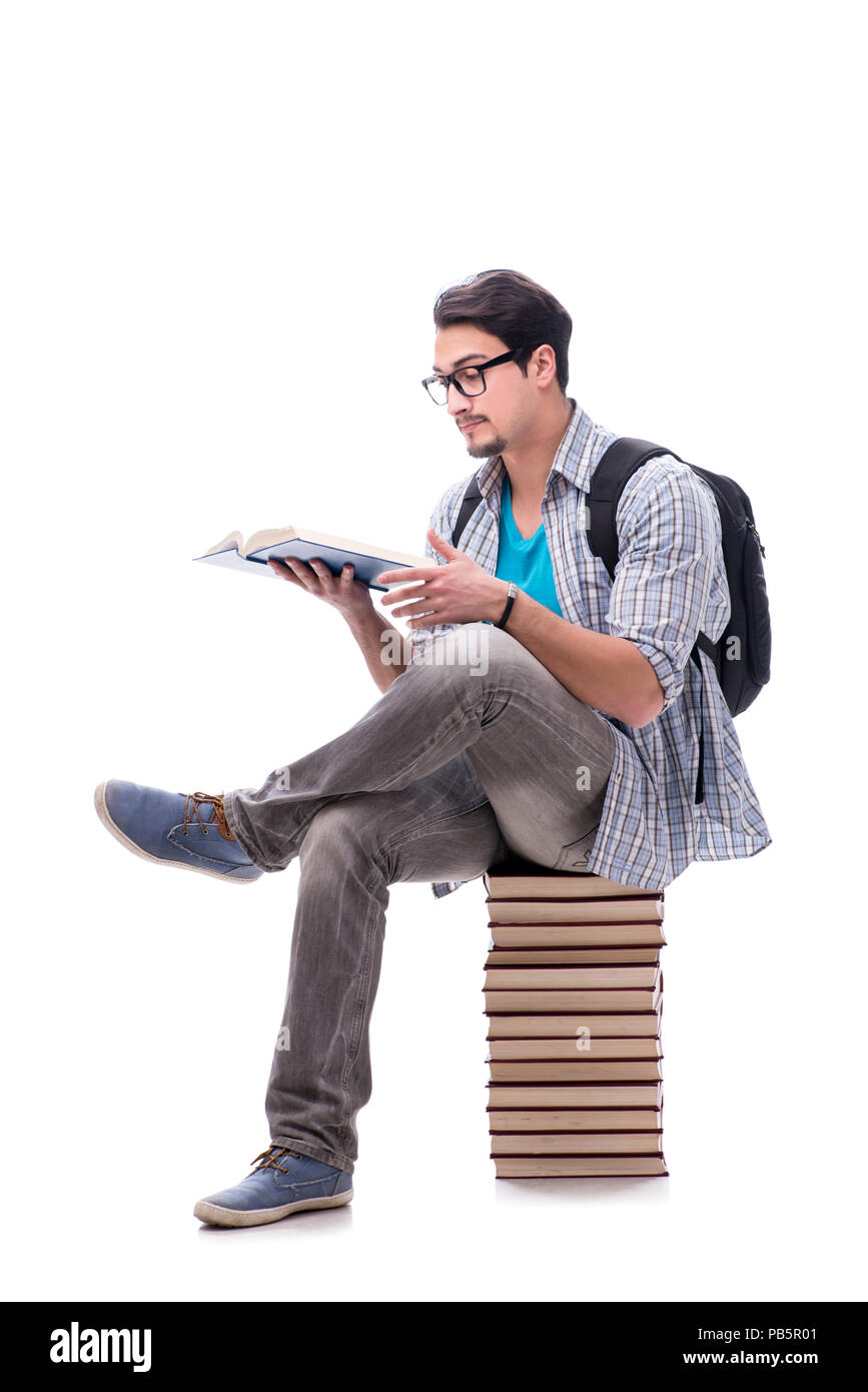 Young student sitting on top of book stack on white Stock Photo - Alamy