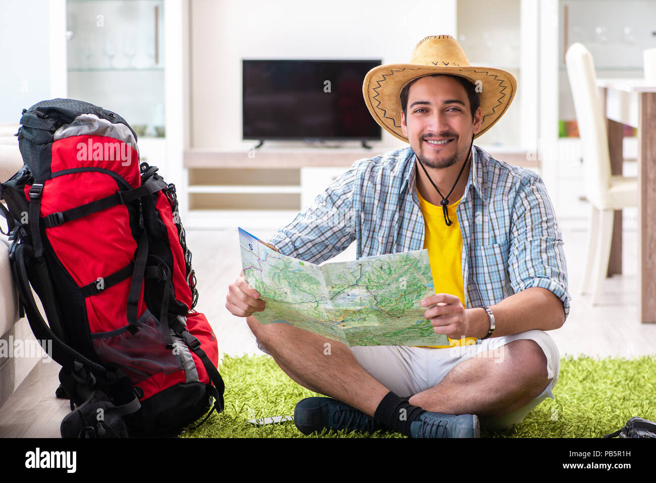 Man planning his travel with map Stock Photo - Alamy