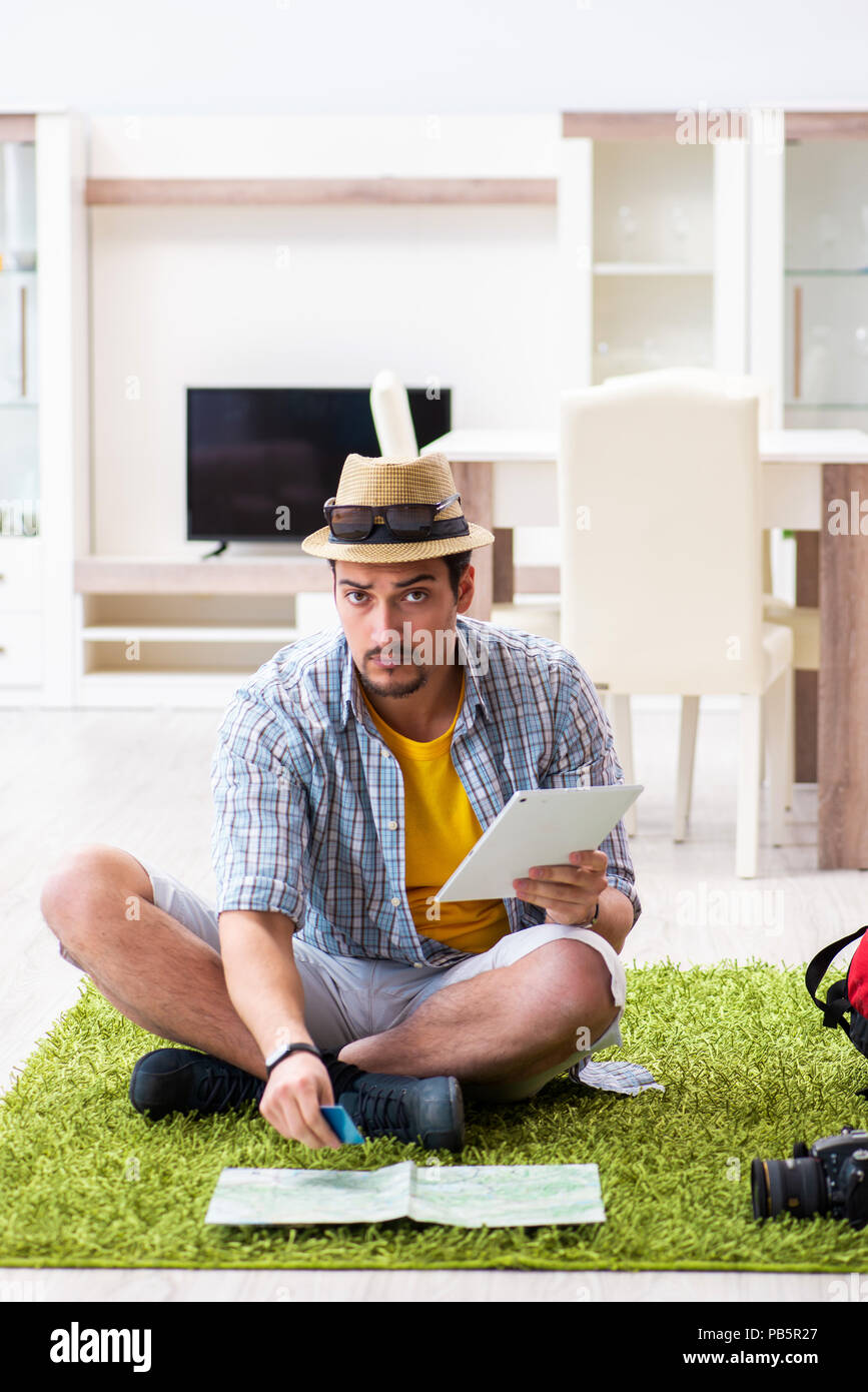 Man planning his travel with map Stock Photo - Alamy