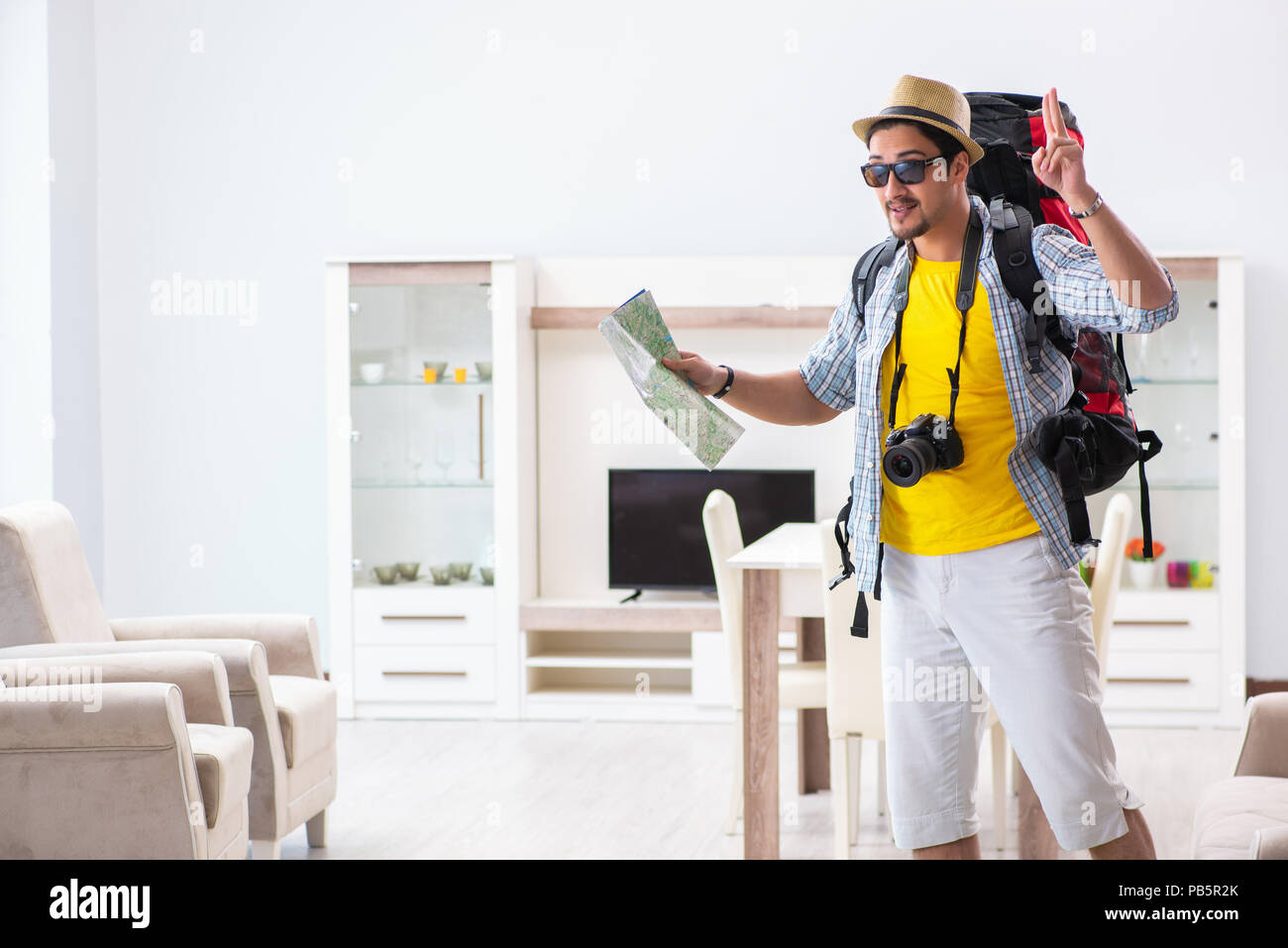 Man planning his travel with map Stock Photo - Alamy