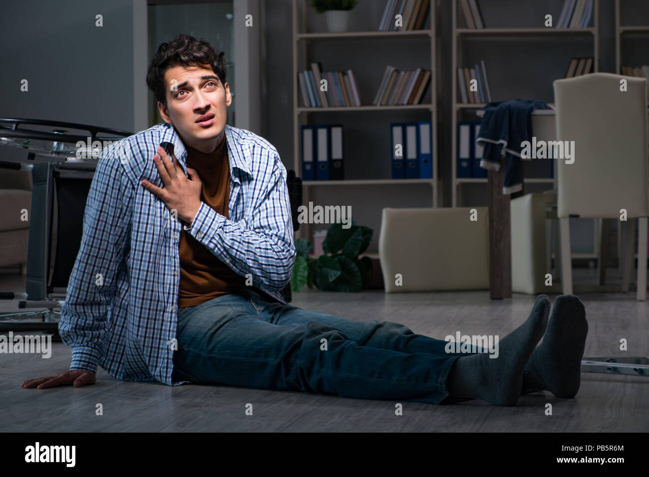 Man fell off wheelchair sitting on the floor Stock Photo - Alamy