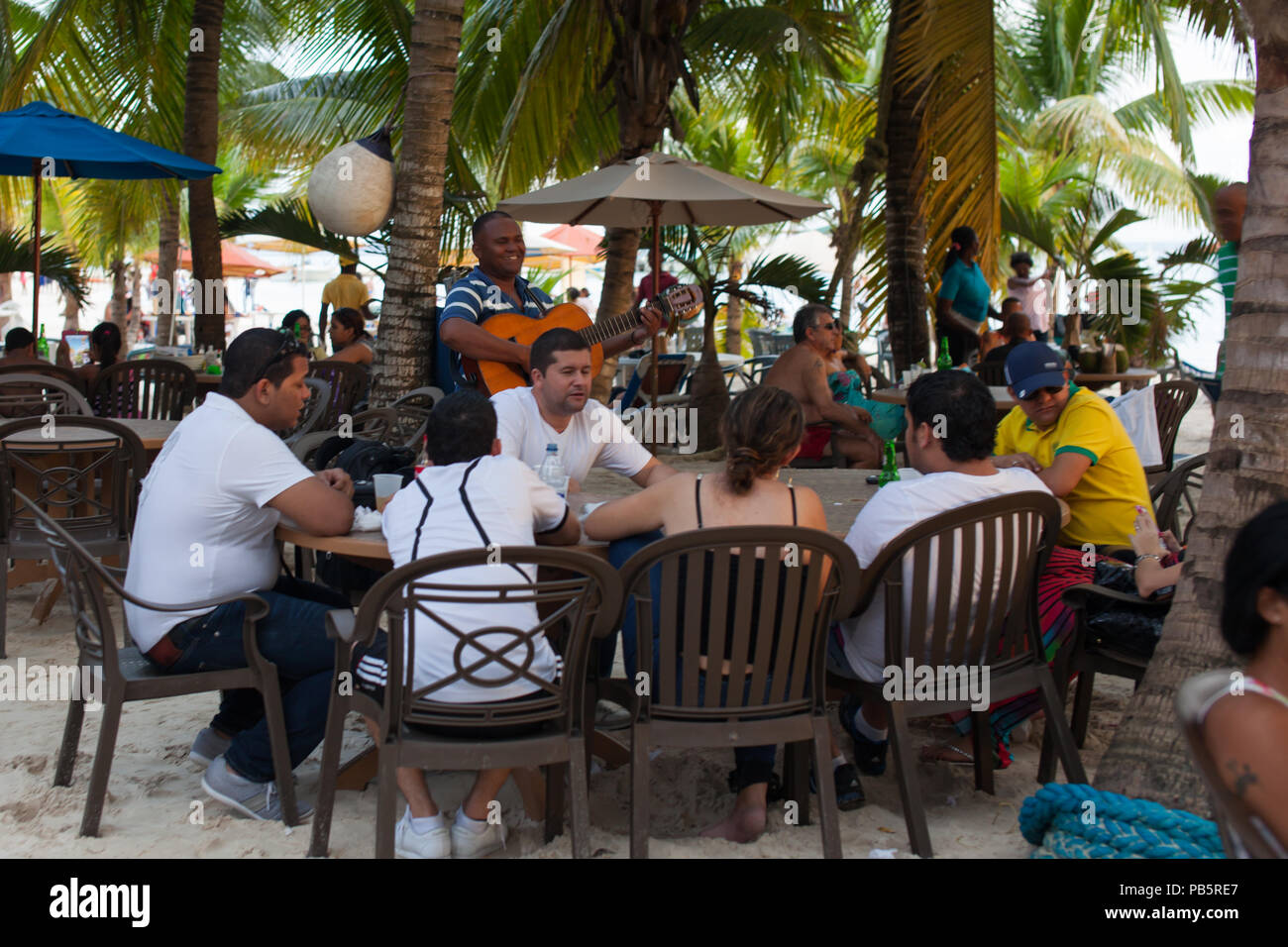 People eating at an outside cafe on the beach Stock Photo - Alamy