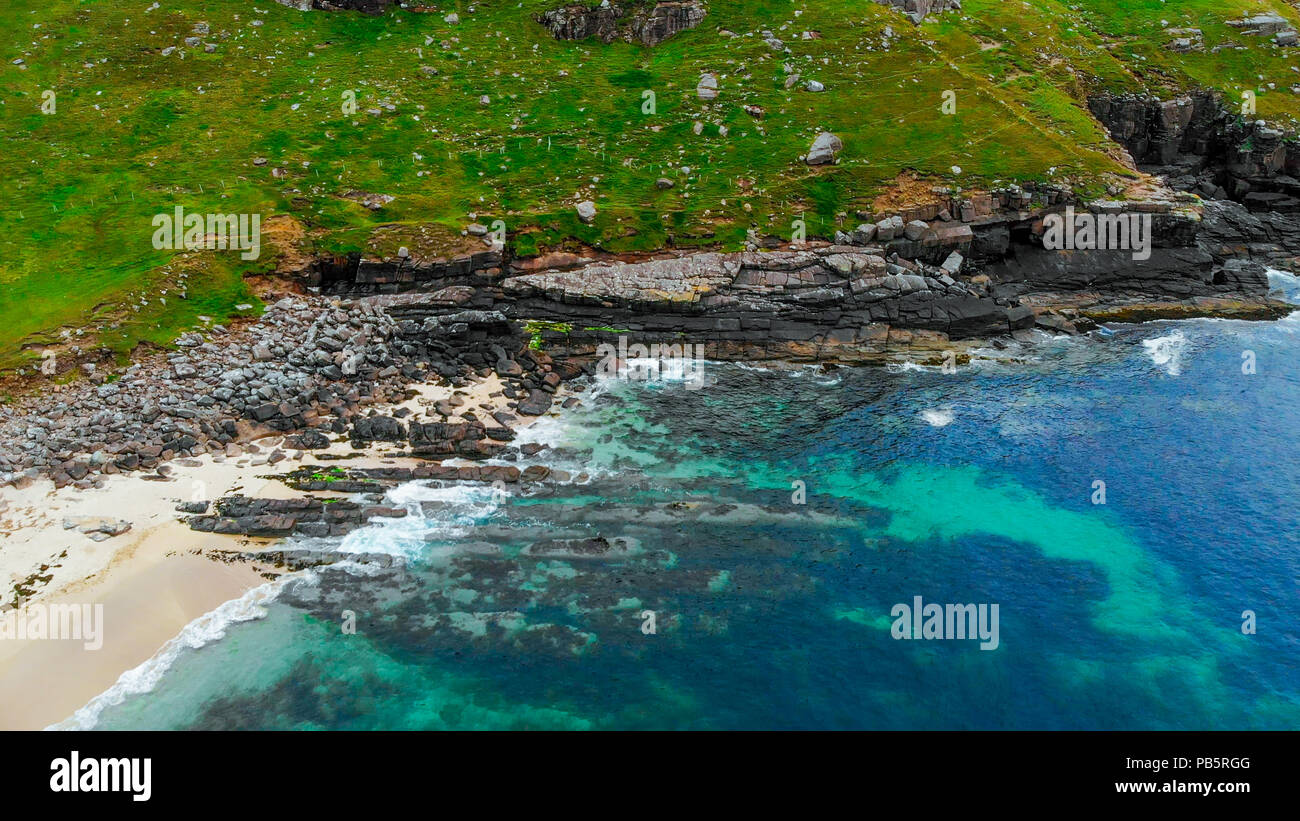 Clear blue ocean water and rocks at the Scottish coastline Stock Photo ...
