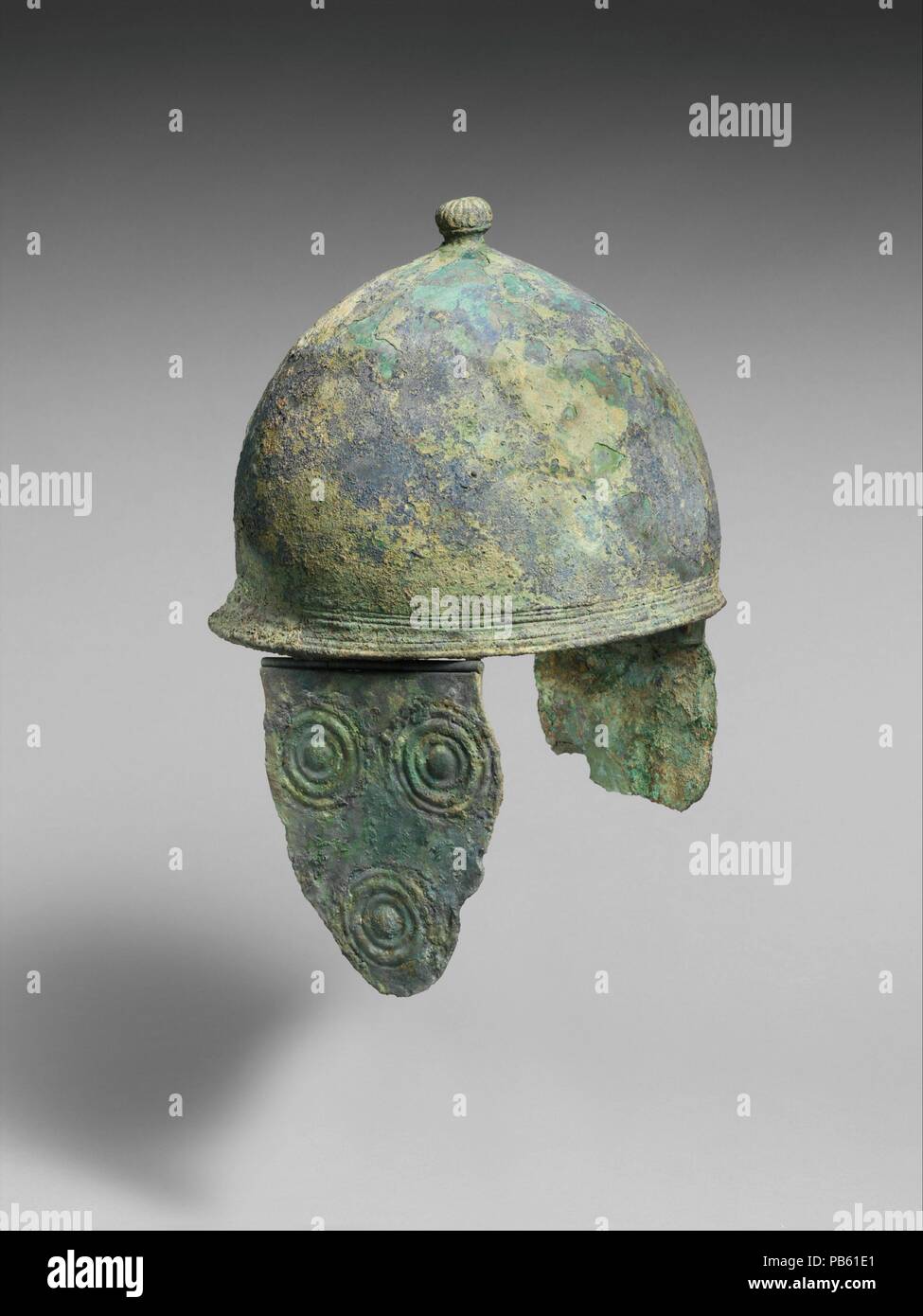 Bronze helmet with cheek-guards. Culture: Etruscan. Dimensions: H.: 7 1 ...
