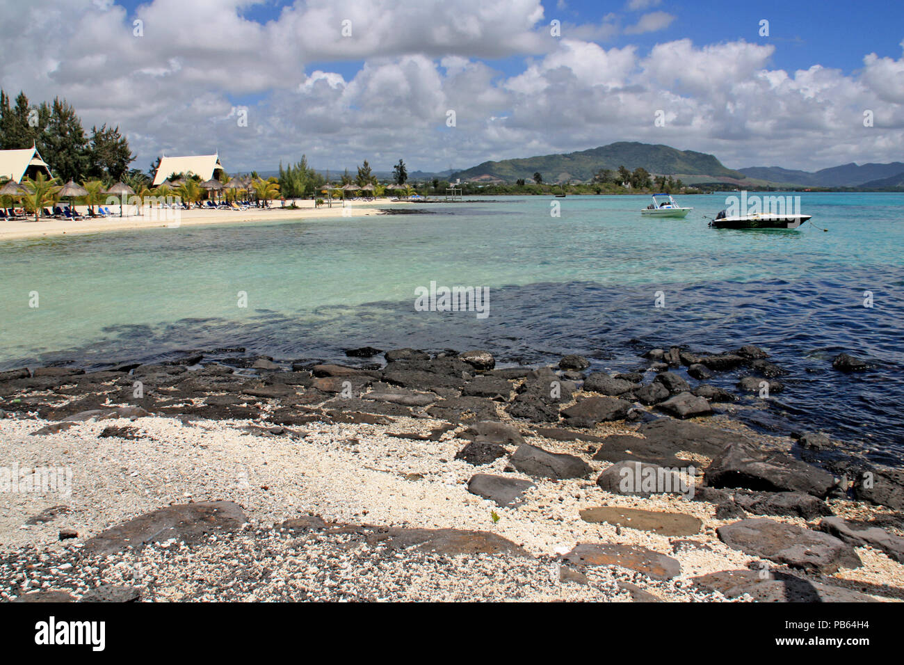 White sand, turquois, shallow water and volcanic rocks at a beautiful ...