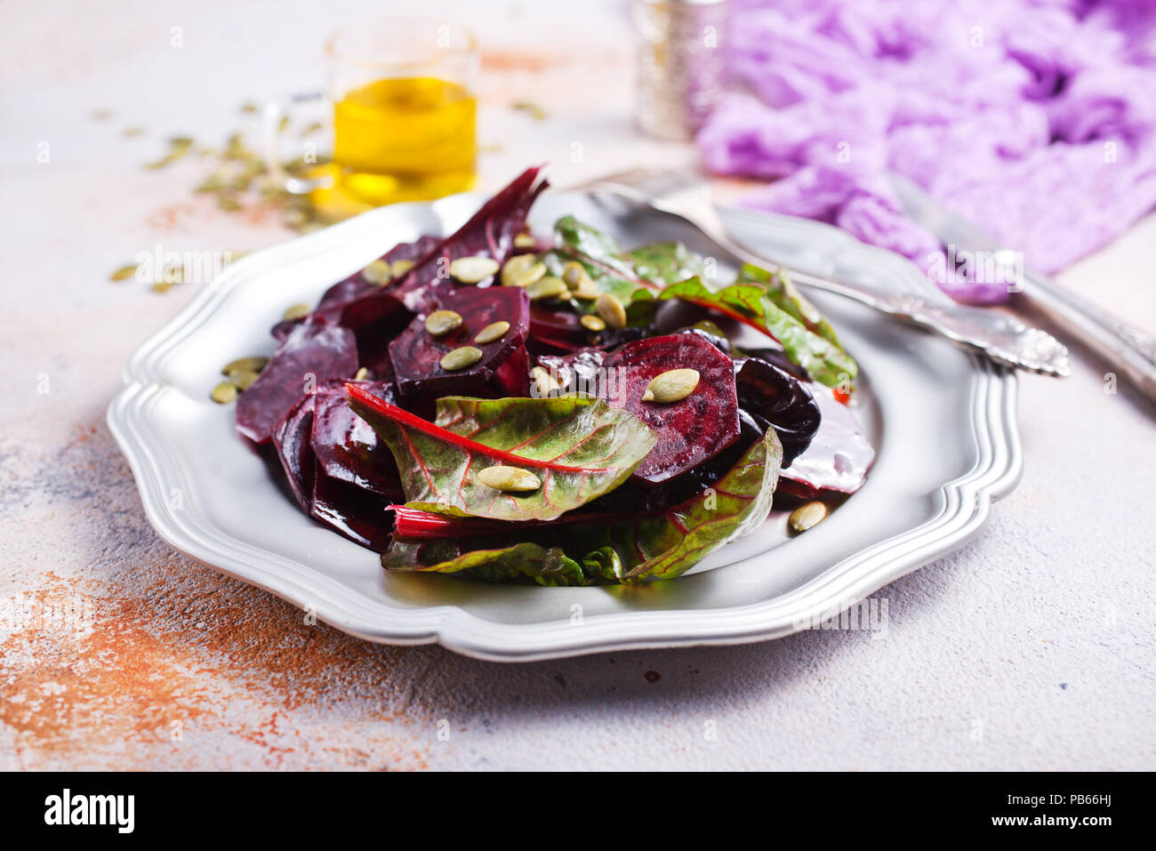 beet salad with nuts on metal plate Stock Photo - Alamy