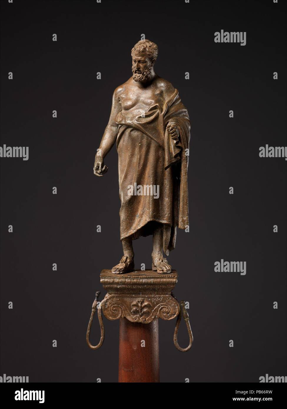 Bronze statuette of a philosopher on a lamp stand. Culture: Roman ...