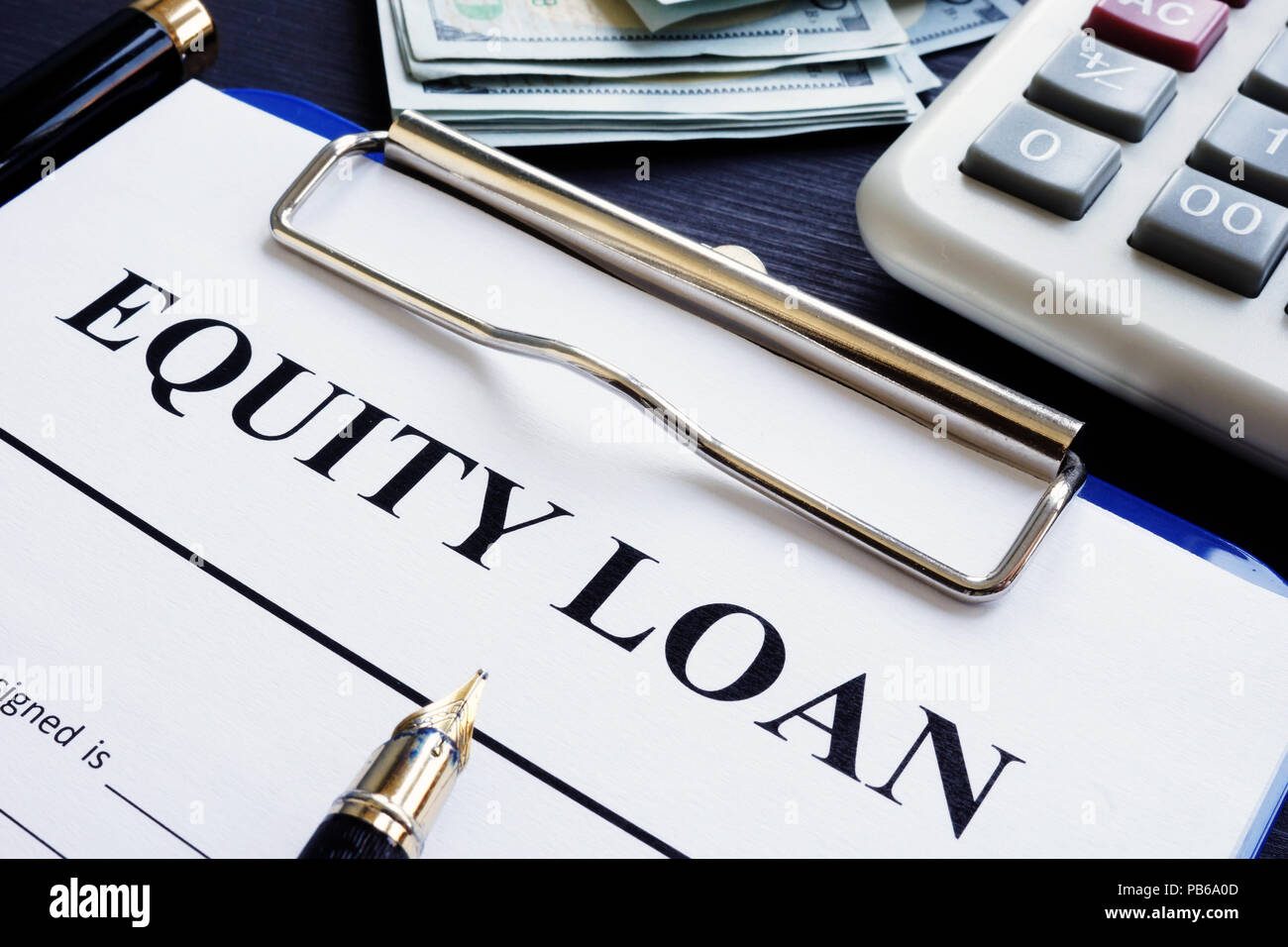 Equity loan application, pen and calculator Stock Photo - Alamy