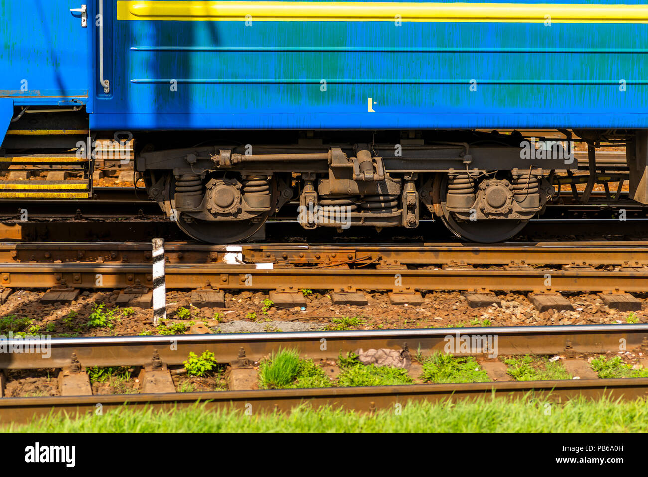 wheel of a modern passenger car of a train, wheels of a train on rails ...