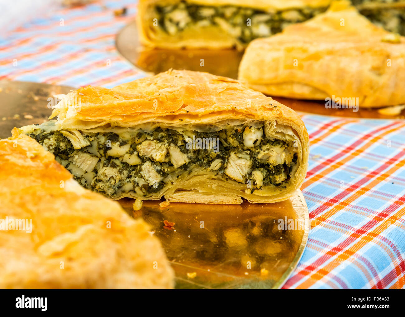 Home-made pastries with chicken meat on the table, cut pie with chicken ...