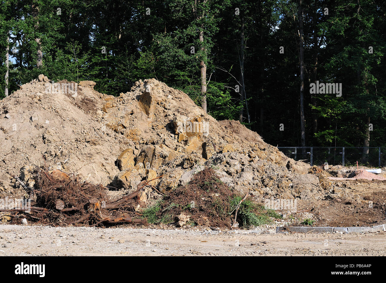heap of soil excavated at large construction site at forest edge Stock ...