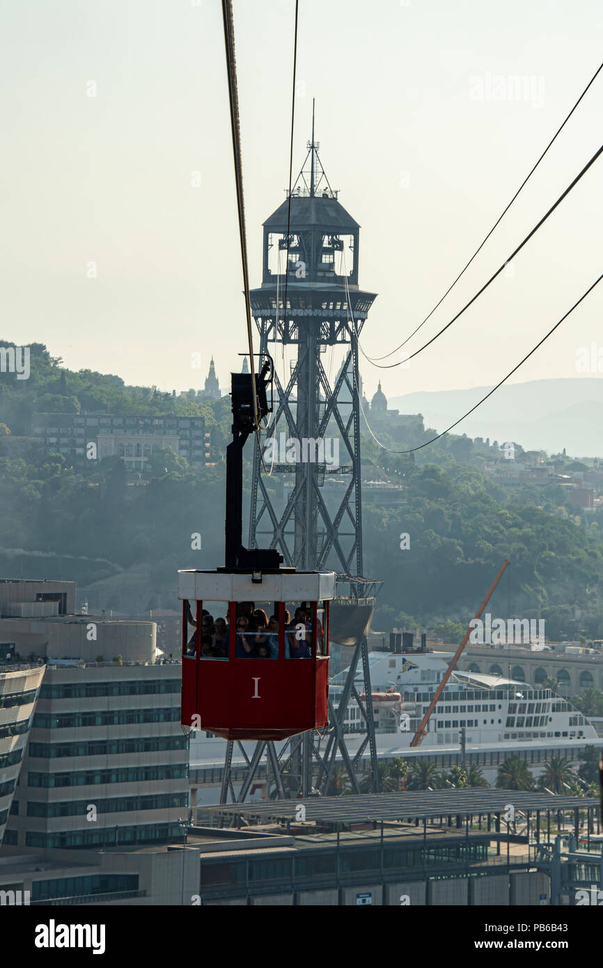 ES, Barcelona Port Cable Car - June 2018: Loaded cable car coming in to ...