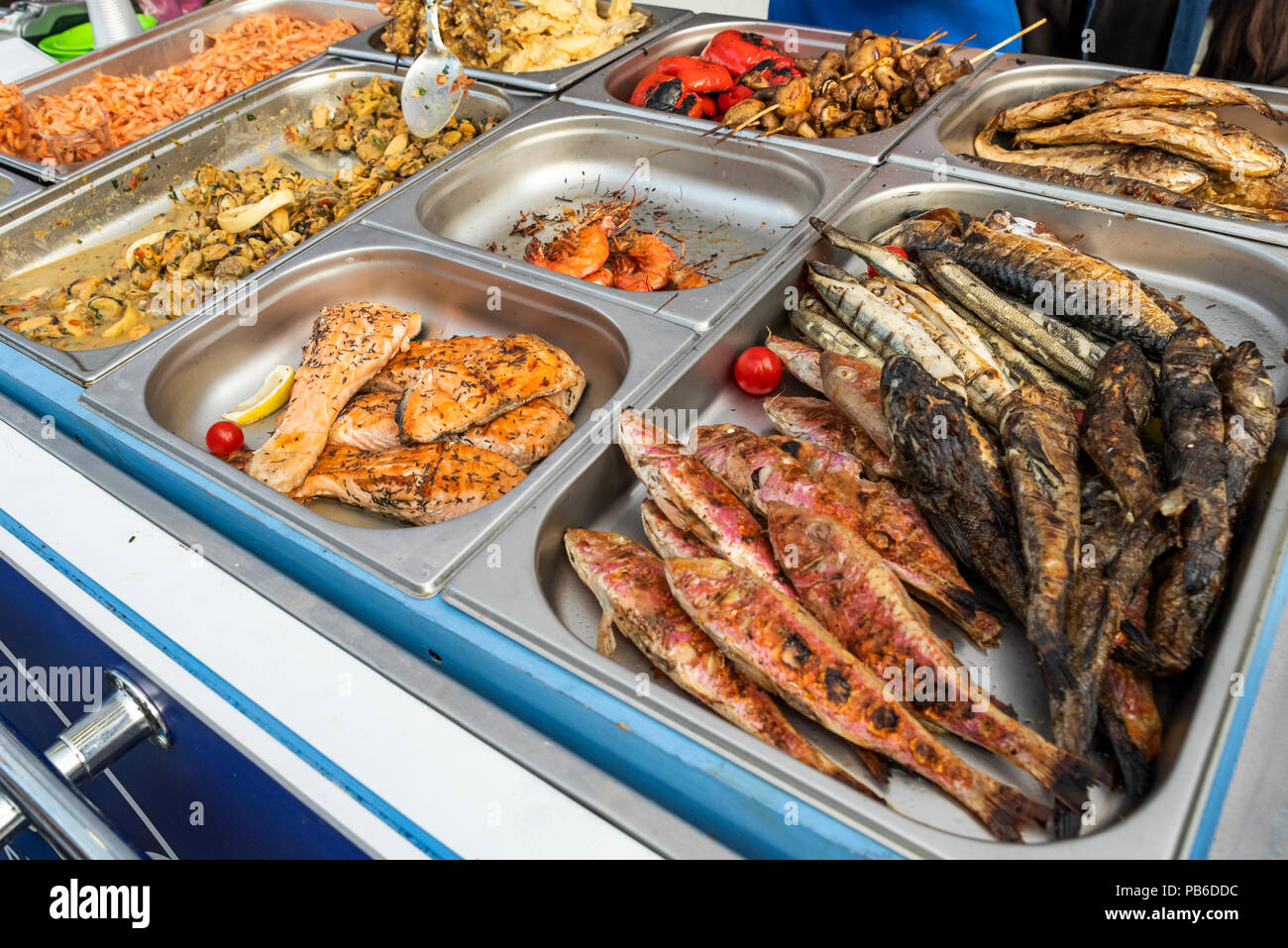 counter with seafood cooked on the grill Stock Photo - Alamy