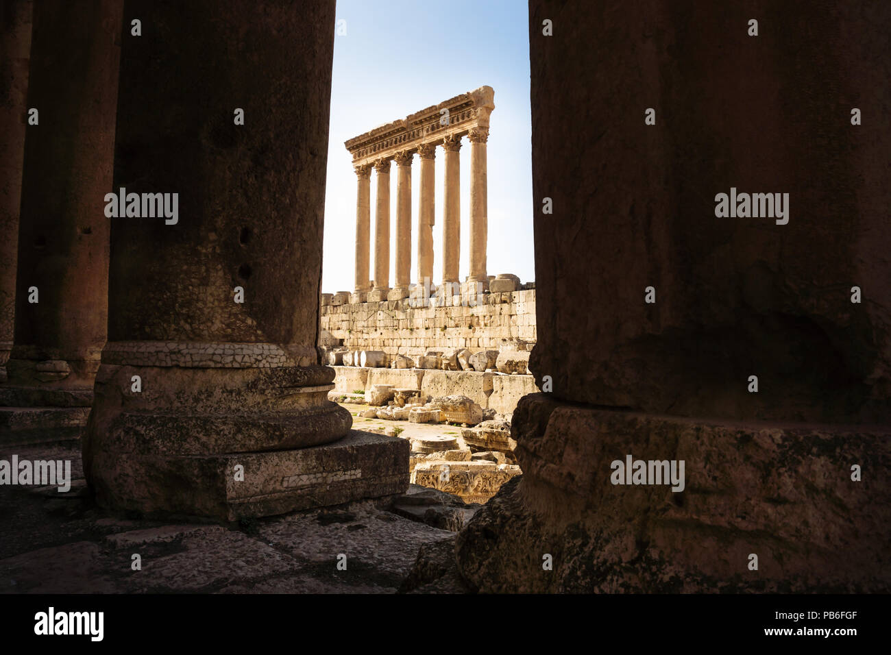 The high columns of the Jupiter Tempel of Baalbek seen through columns ...