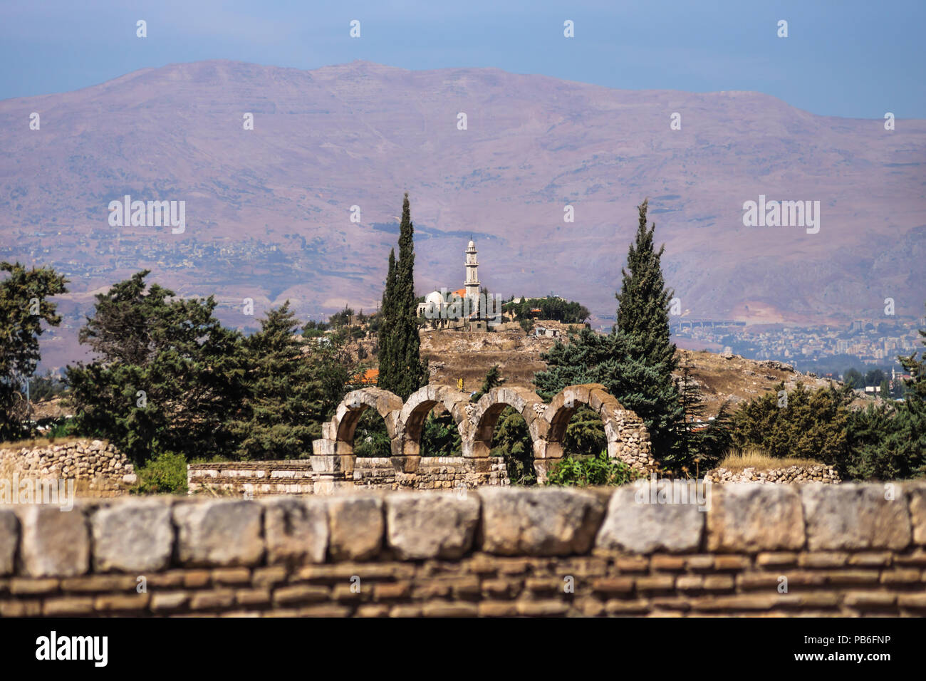 Mosque on a hill with Mountains in the background on a sunny day at ...