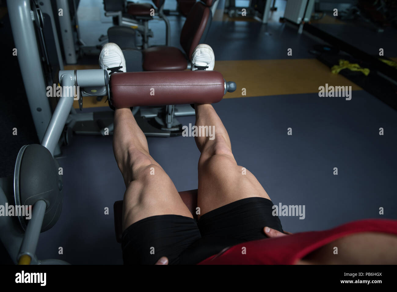 Leg Exercises Close Up - Man Doing Leg With Machine In Gym Stock Photo ...