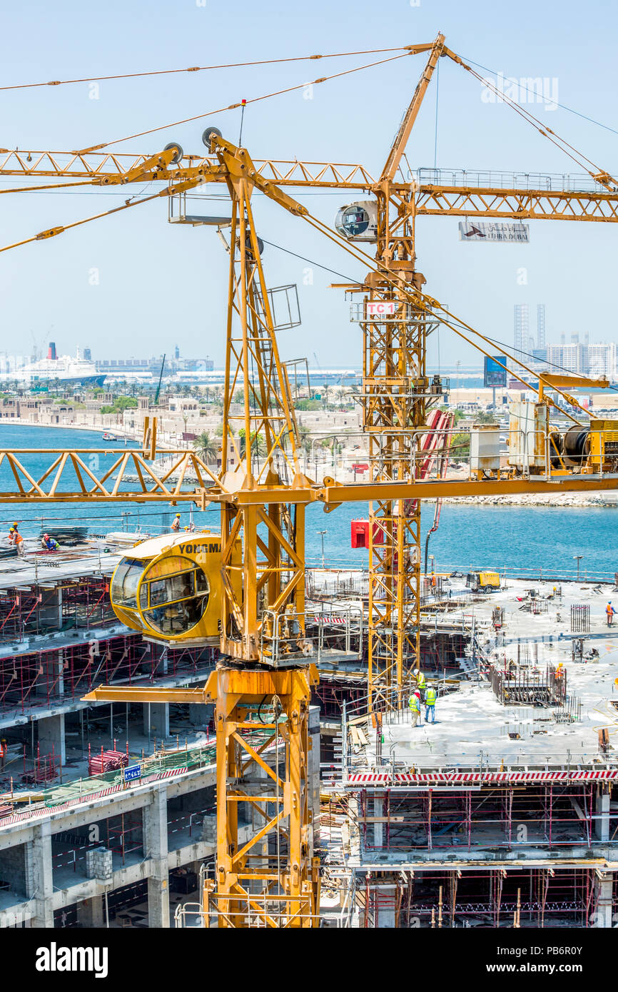 Crains on construction site of building Stock Photo - Alamy