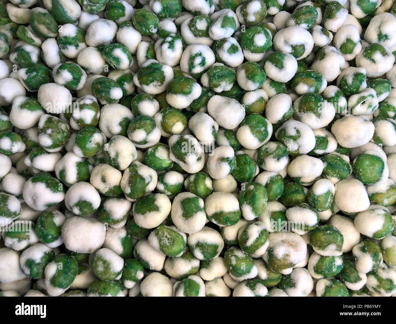 Food background wasabi peas. Wasabi peas are green peas that have been ...