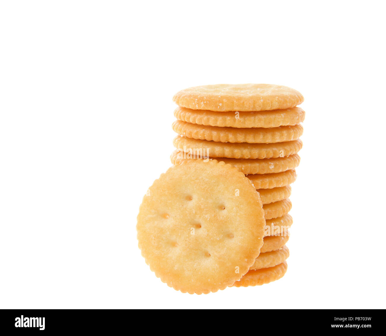 Round salted crackers stacked with one cracker in front isolated on ...