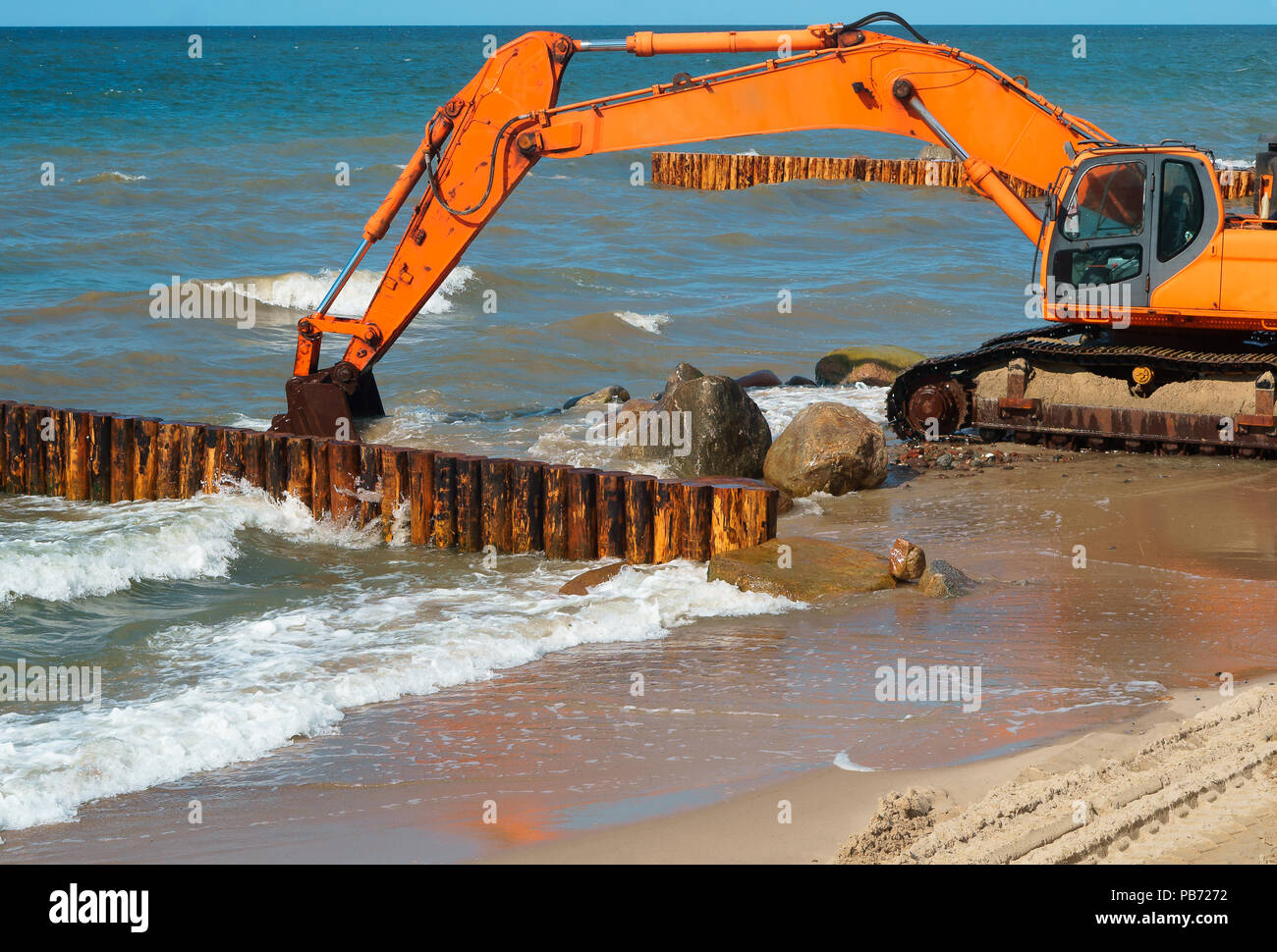 construction equipment on the shore, the construction of breakwaters ...