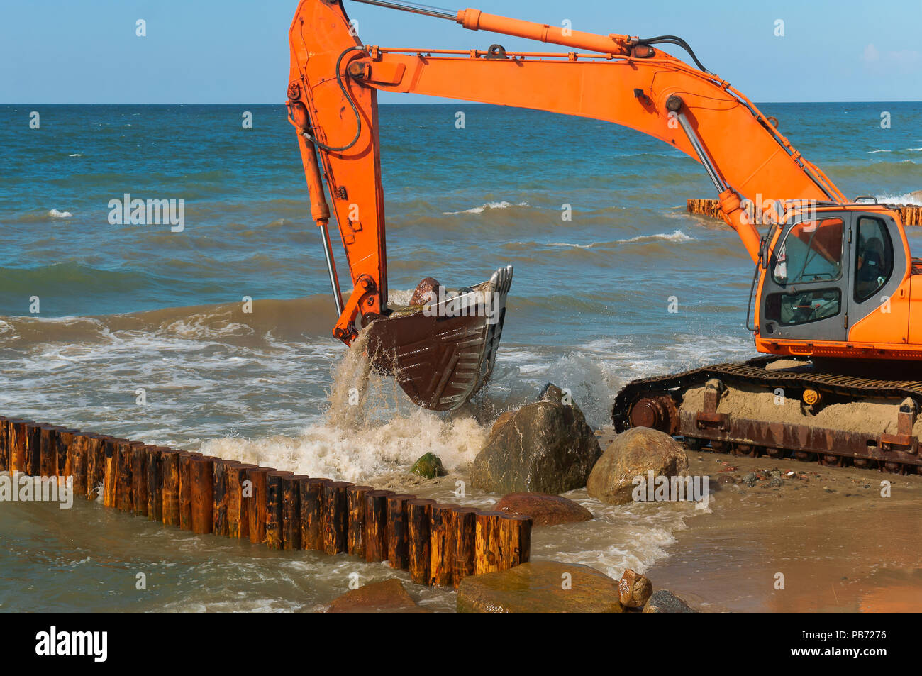 construction equipment on the shore, the construction of breakwaters ...